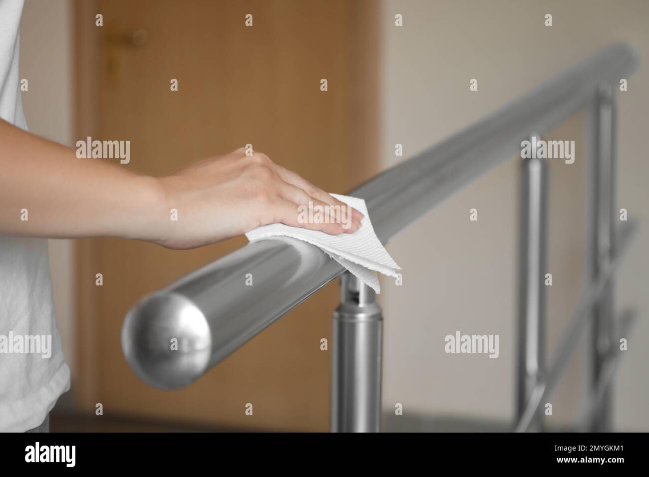 Woman cleaning metal railing hi-res stock photography and images - Alamy