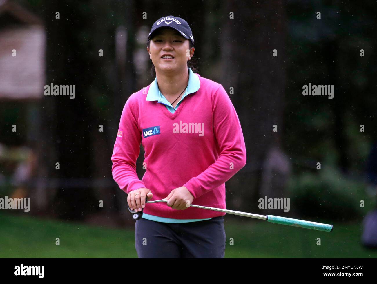 Lydia Ko smiles as she heads off a green in the second round at the ...