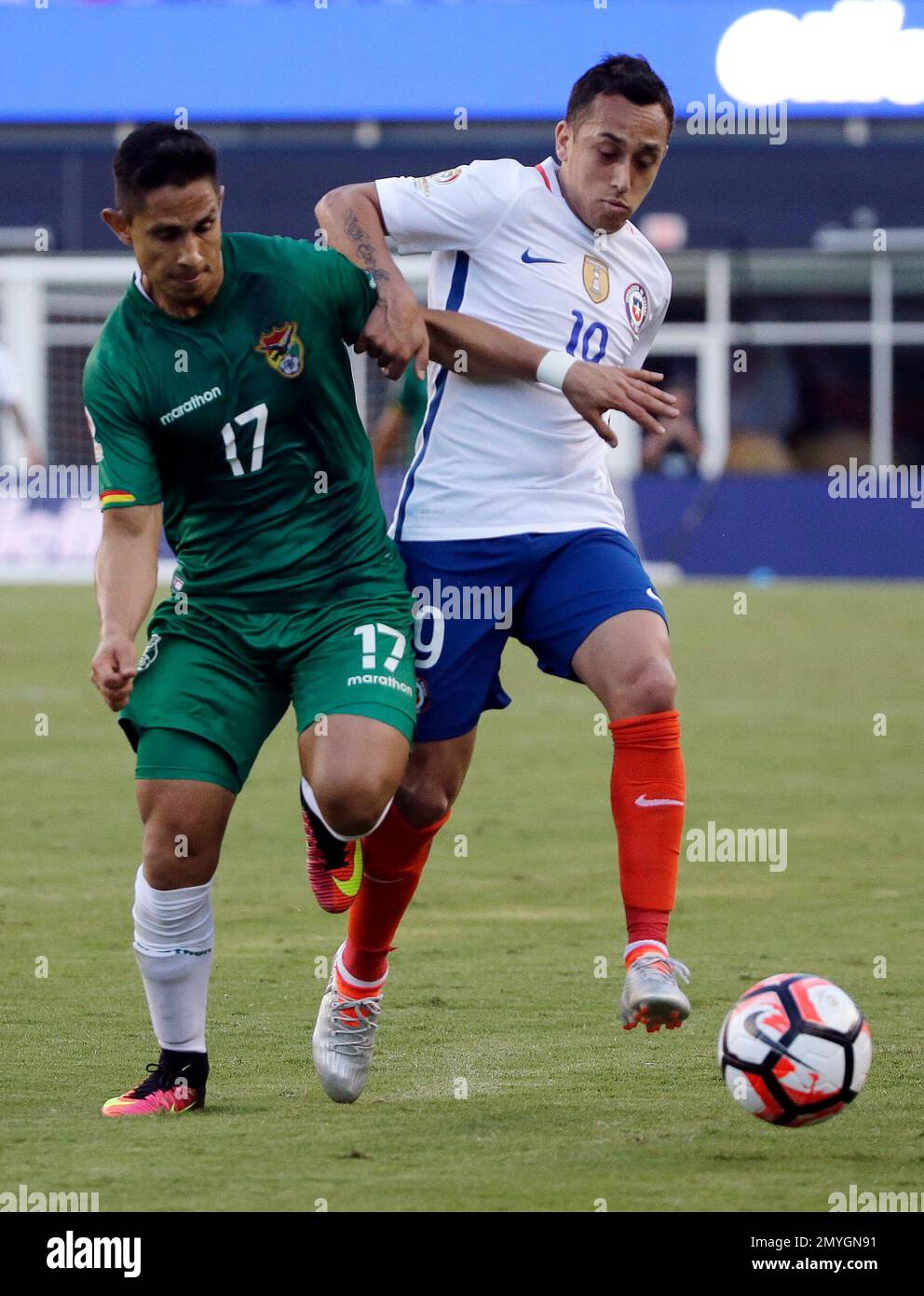 Bolivia's Marvin Bejarano (17) and Chile's Pablo Hernandez (10) battle ...