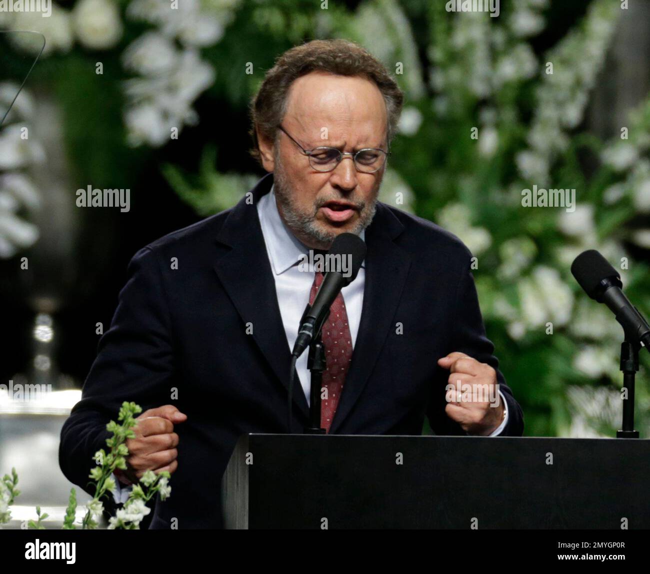 Comedian Billy Crystal imitates Muhammad Ali during his memorial ...