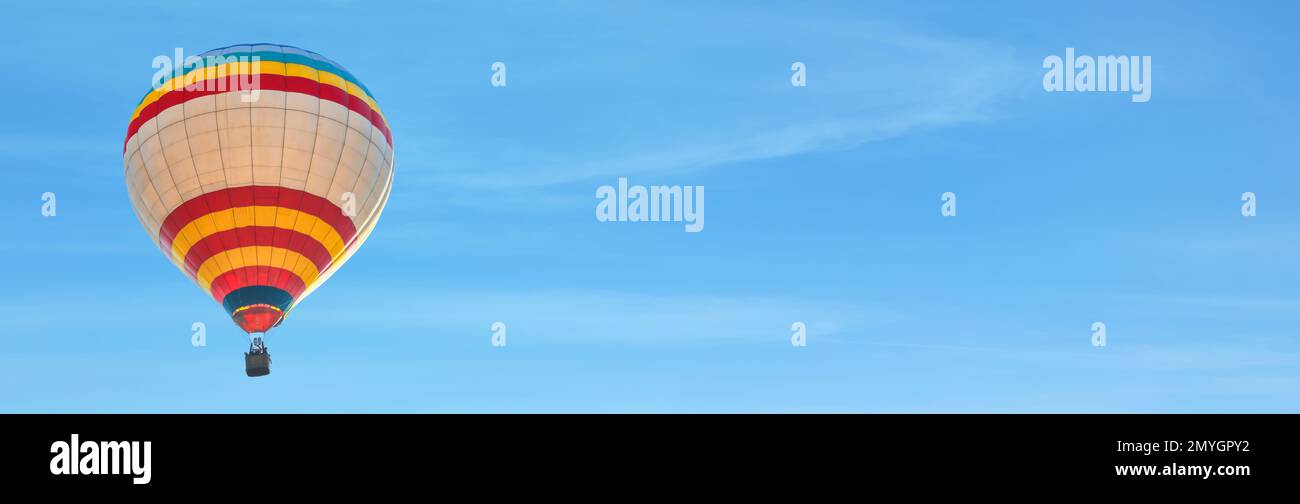 Hot air balloon in blue sky, space for text. Banner design Stock Photo ...