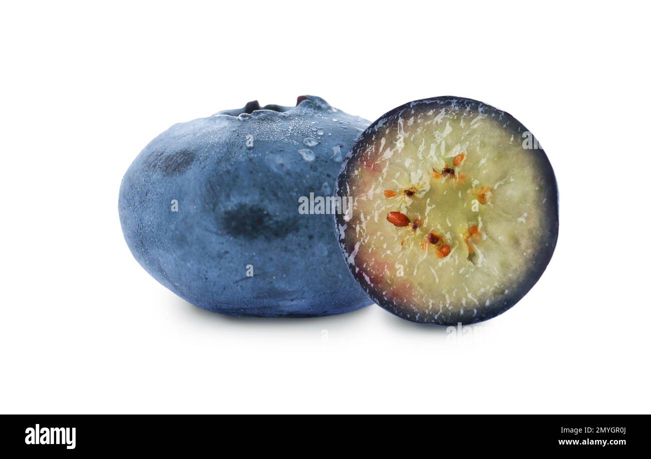 Cut and whole blueberries on white background Stock Photo - Alamy