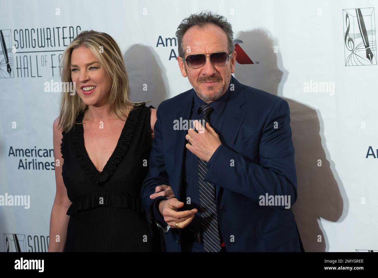 Inductee Elvis Costello, right, and his wife Diana Krall attend the ...