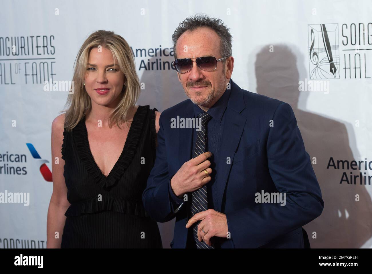 Inductee Elvis Costello, right, and his wife Diana Krall attend the ...