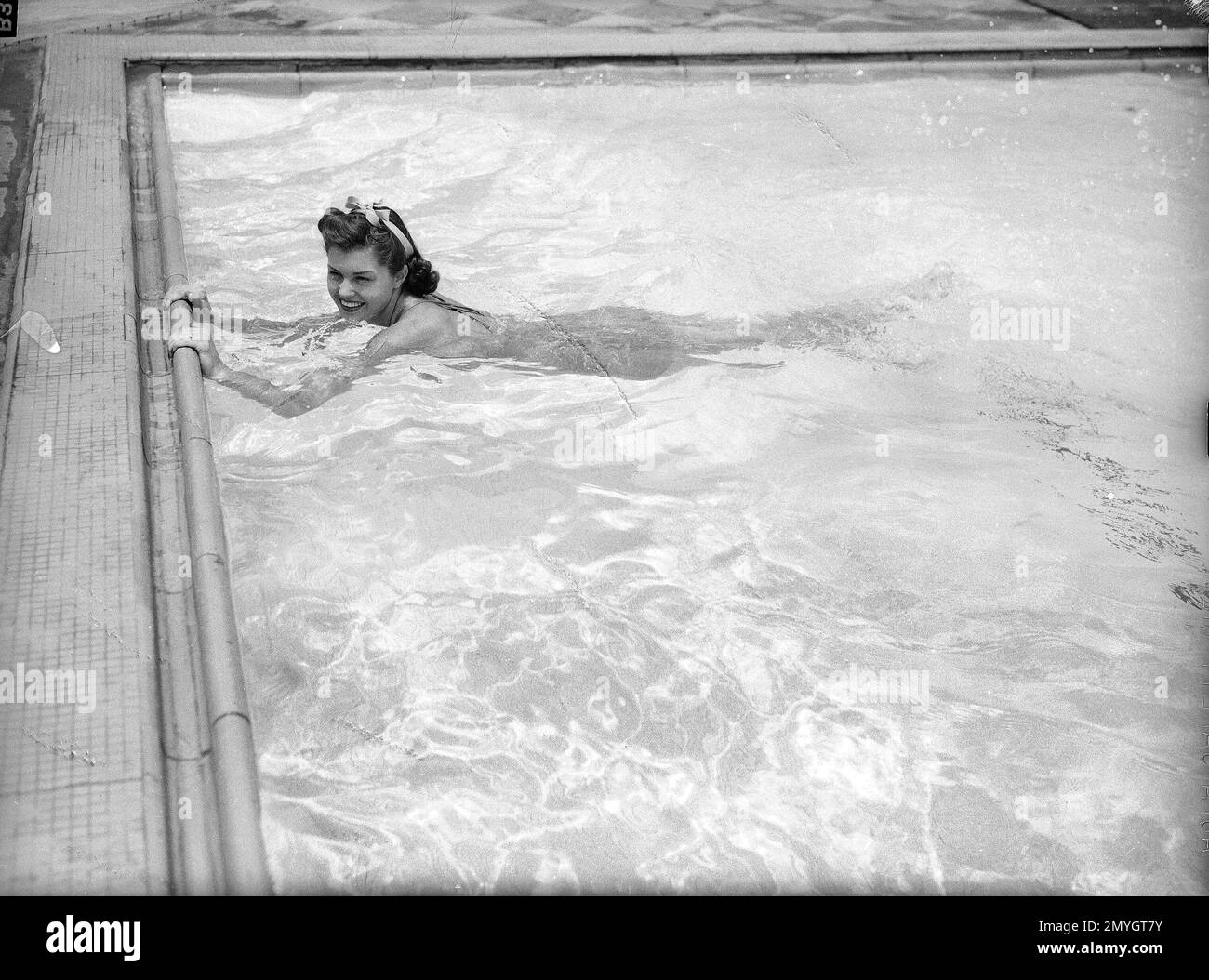 Film actress Esther Williams, former swimming champion, demonstrates ...