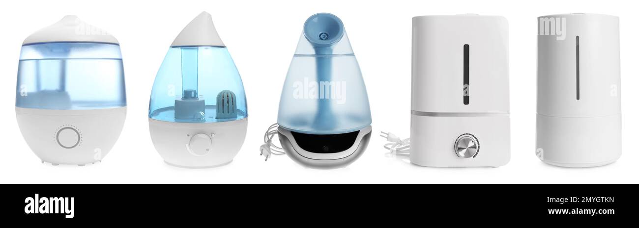 Set of modern air humidifiers on white background Stock Photo - Alamy