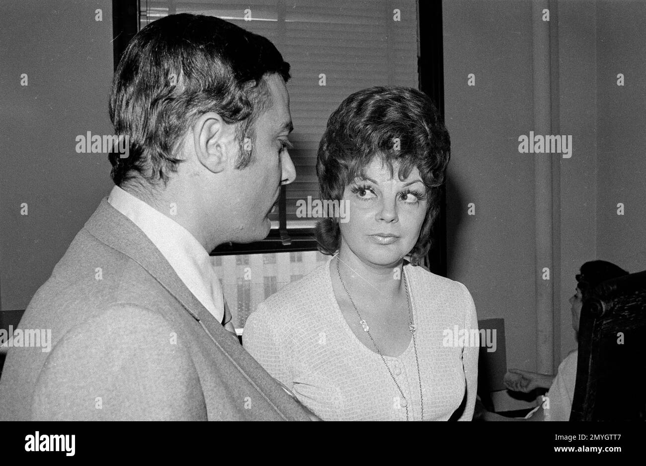 Mrs. Virginia Graham, 37, talks with her attorney, Robert Steinberg, at ...