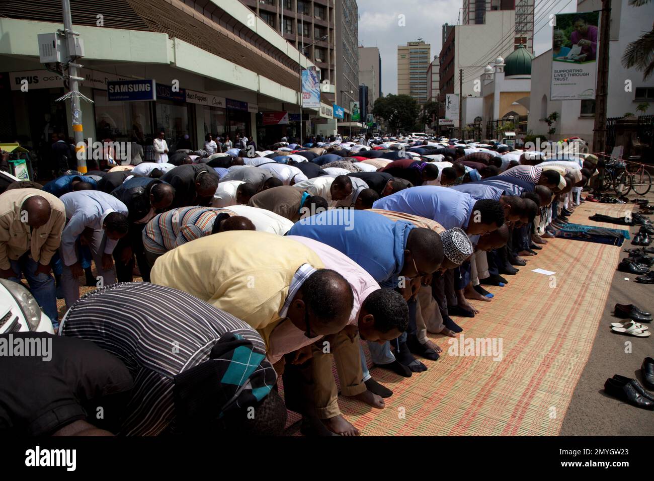 Kenyan Muslims bow down for prayers in the street on the first Friday ...