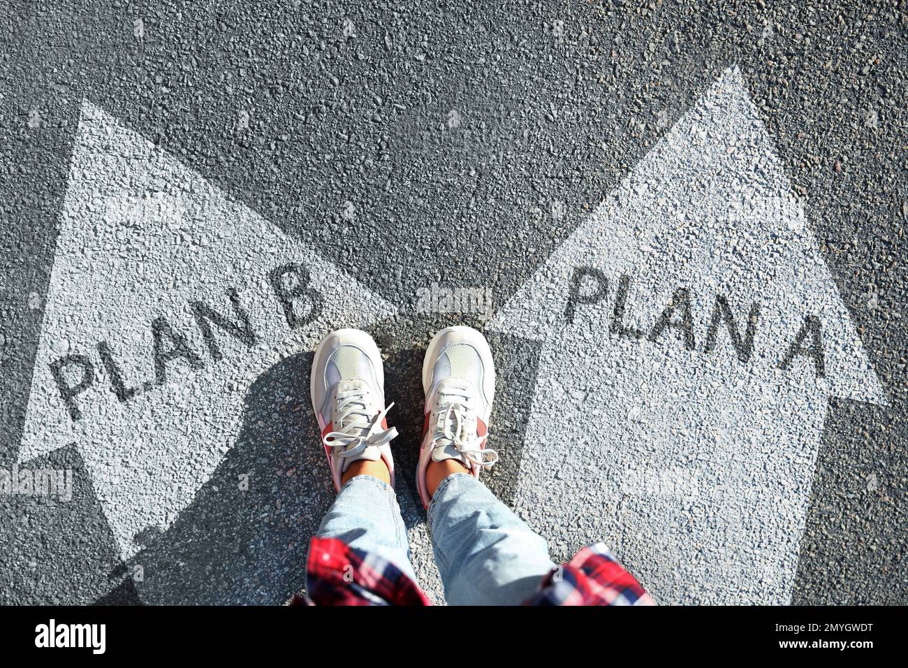 Choosing between Plan A and Plan B. Woman near arrows on road, above ... Choosing between Plan A and Plan B. Woman near arrows on road, above ...