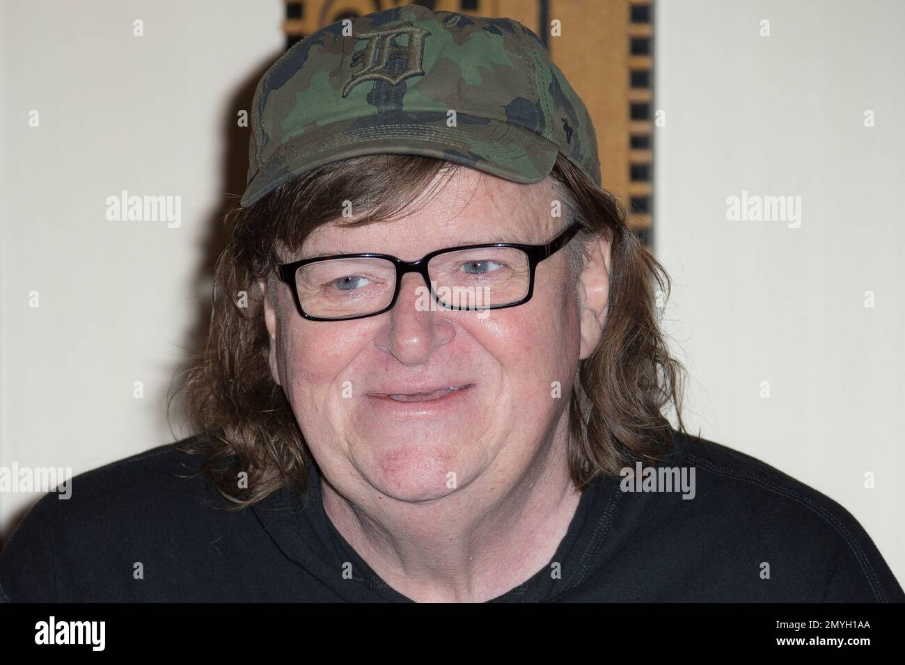 Director Michael Moore poses for photographers at the photo call of his ...