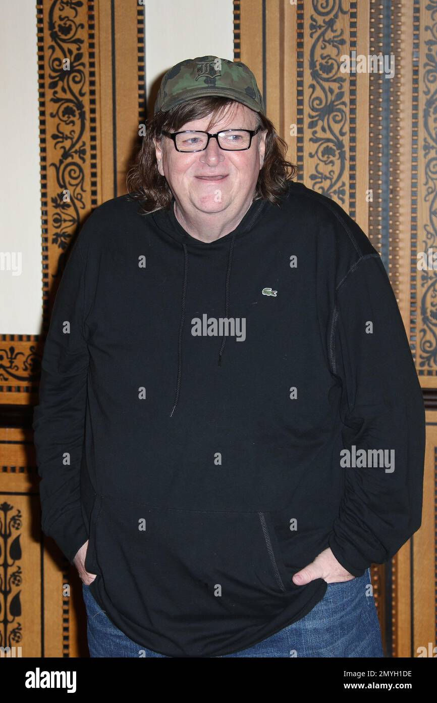 Director Michael Moore poses for photographers at the photo call of his ...