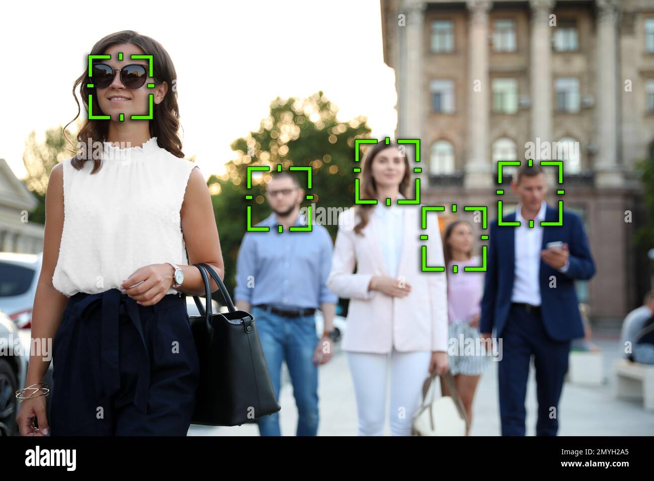 Facial recognition system identifying people on city street Stock Photo ...