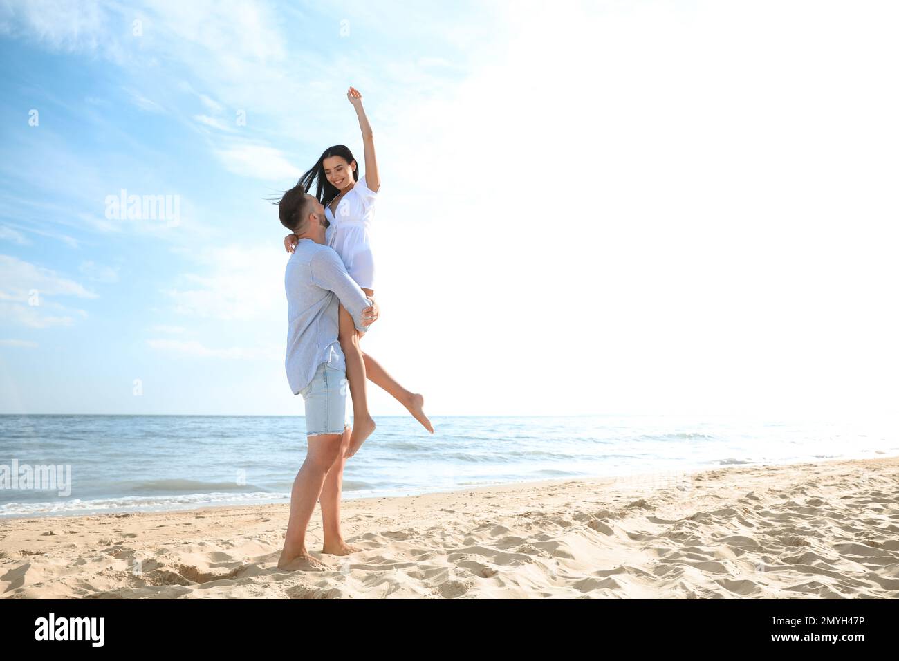 Couple having fun on beach hi-res stock photography and images - Alamy