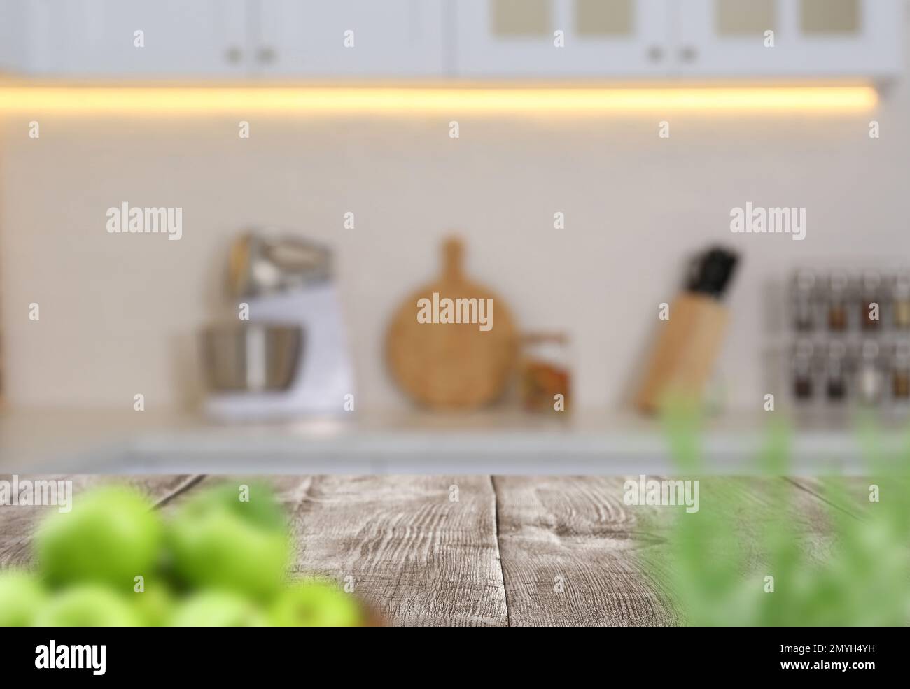 Wooden table in light kitchen. Space for design Stock Photo - Alamy