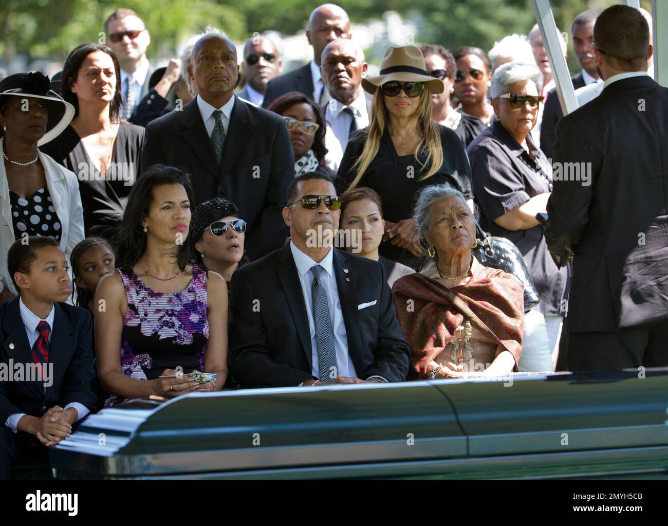 Nola Whitfield, seated right, wife of Olympian gold medalist and ...