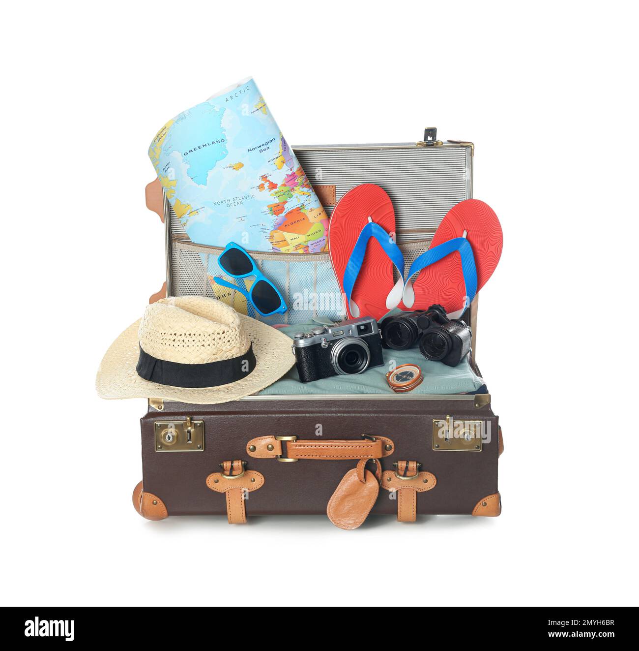 Open vintage suitcase with clothes and beach objects packed for summer ...