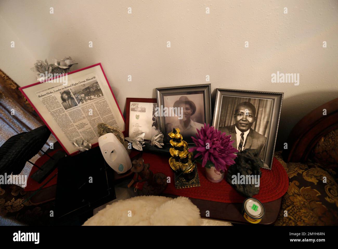 In this Dec. 11, 2015 photo, photos and news clippings of her father ...