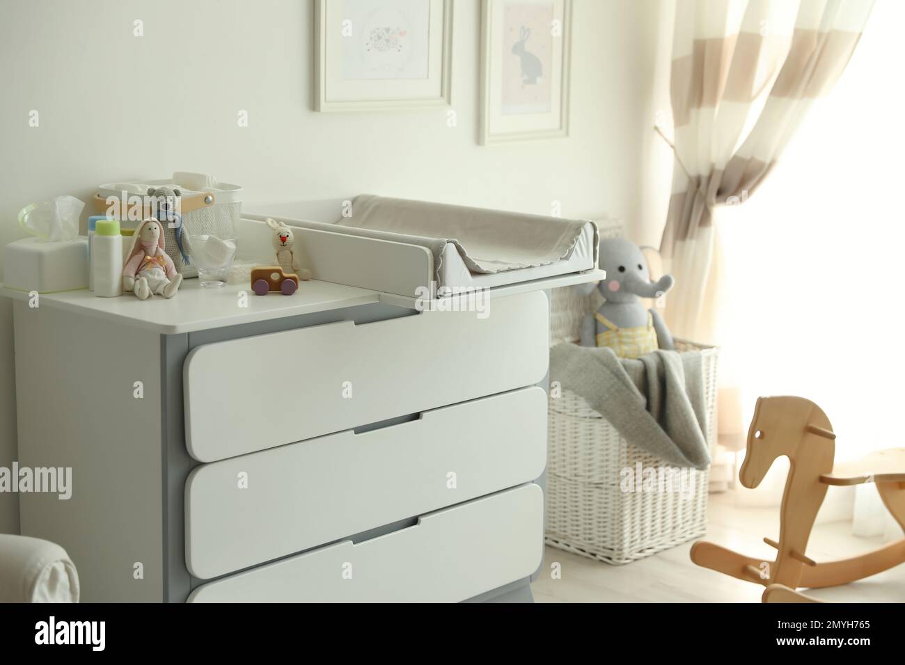 Modern changing table in baby room interior Stock Photo - Alamy