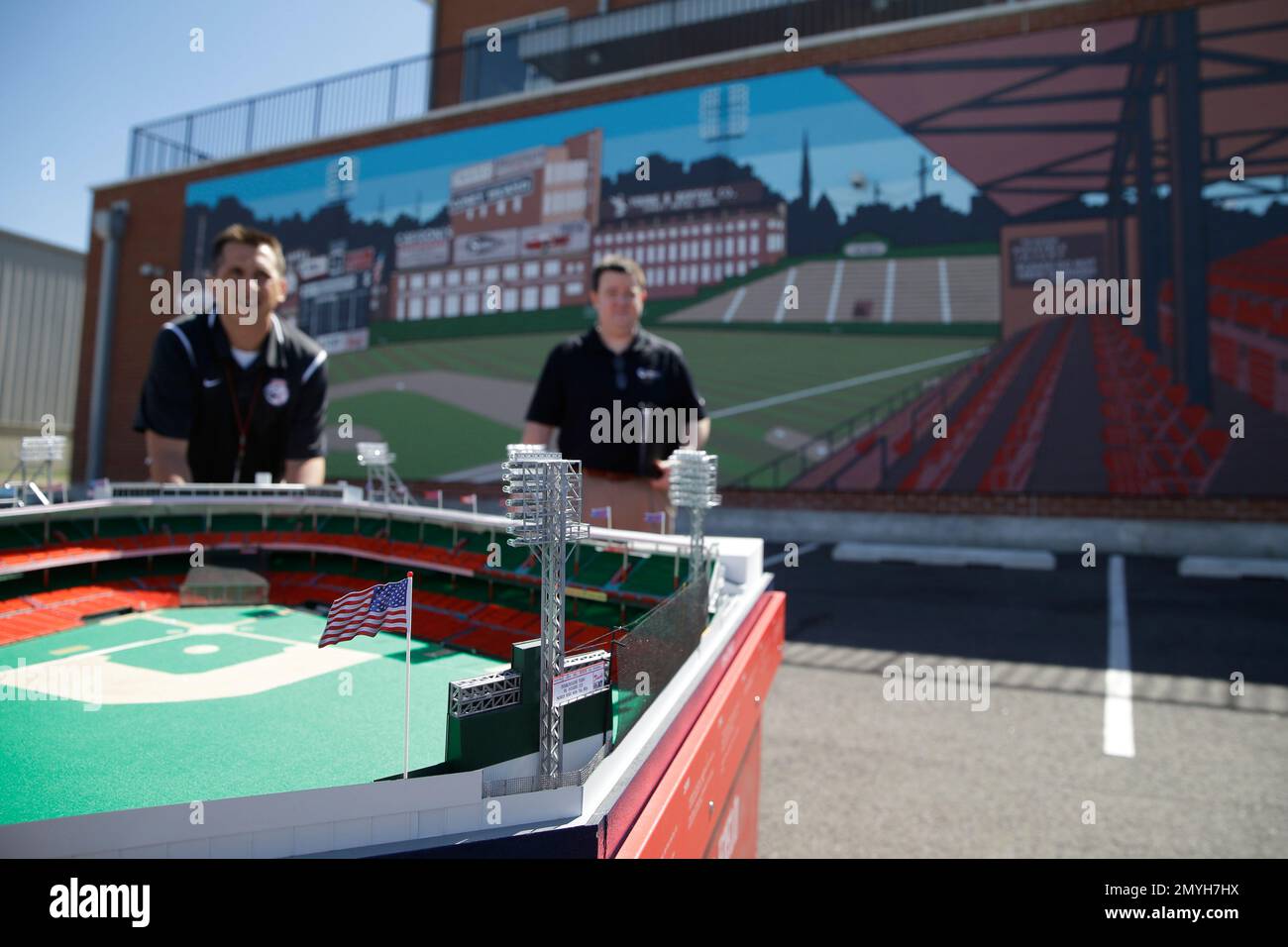 Workers prepare a miniature model of Crosley Field beside a newly ...