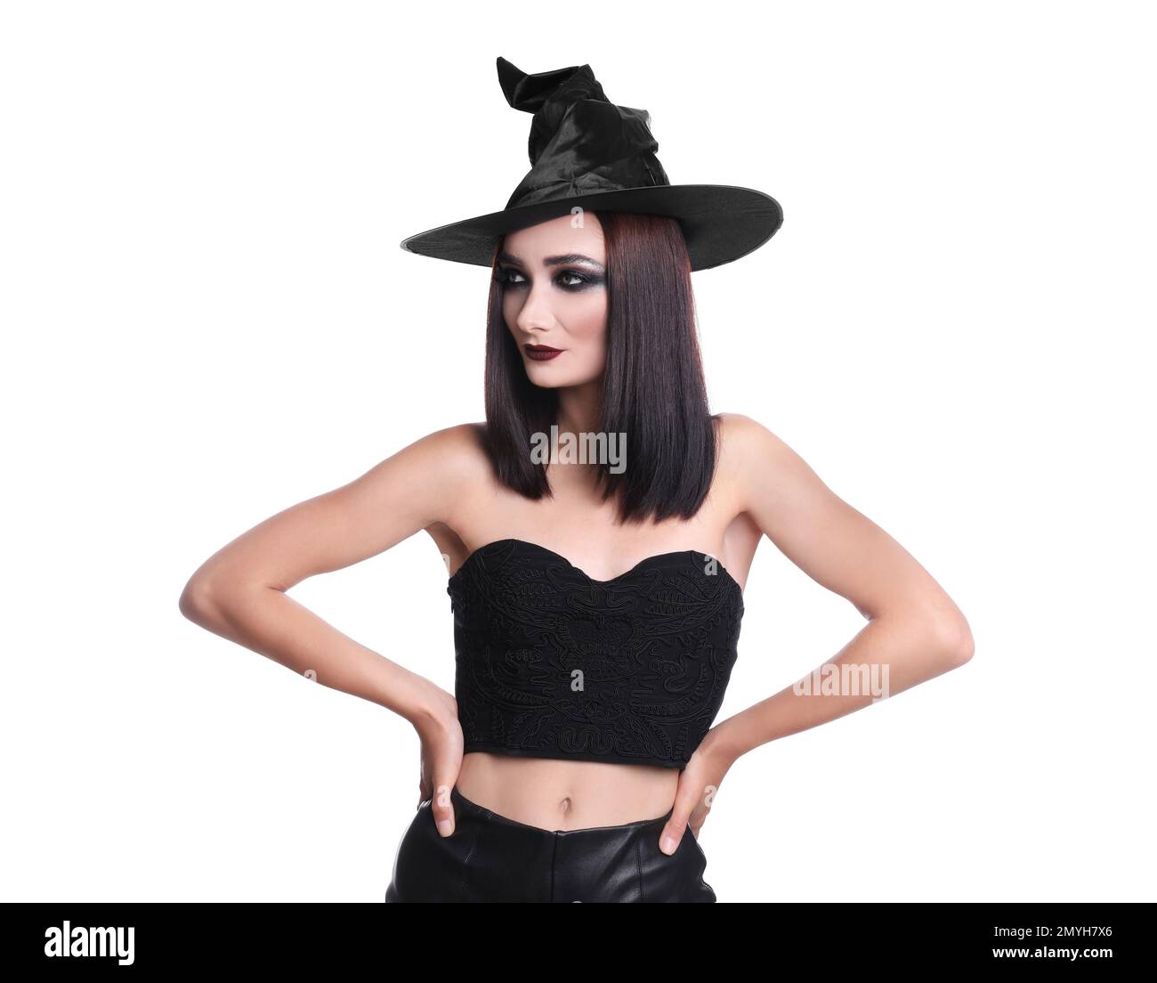 Mysterious witch wearing hat on white background Stock Photo - Alamy