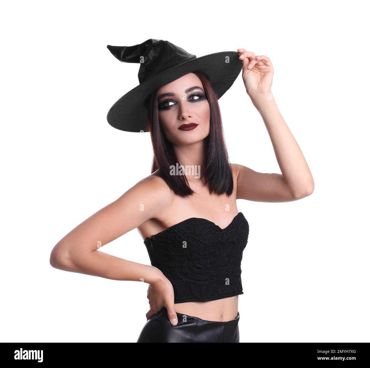 Mysterious witch wearing hat on white background Stock Photo - Alamy