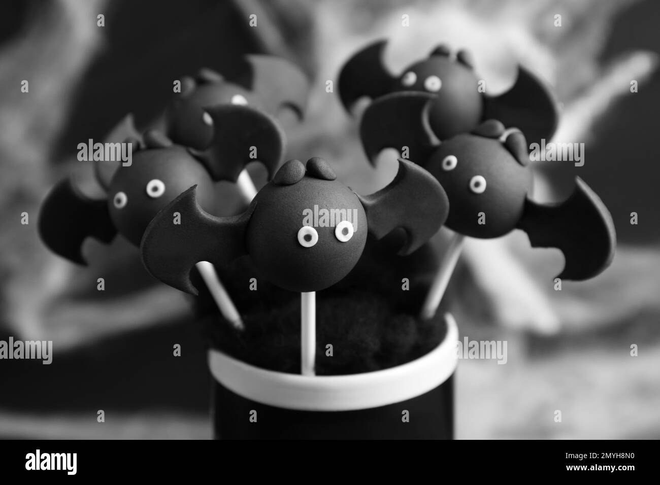 Bat shaped cake pops on dark background, closeup. Halloween treat Stock ...