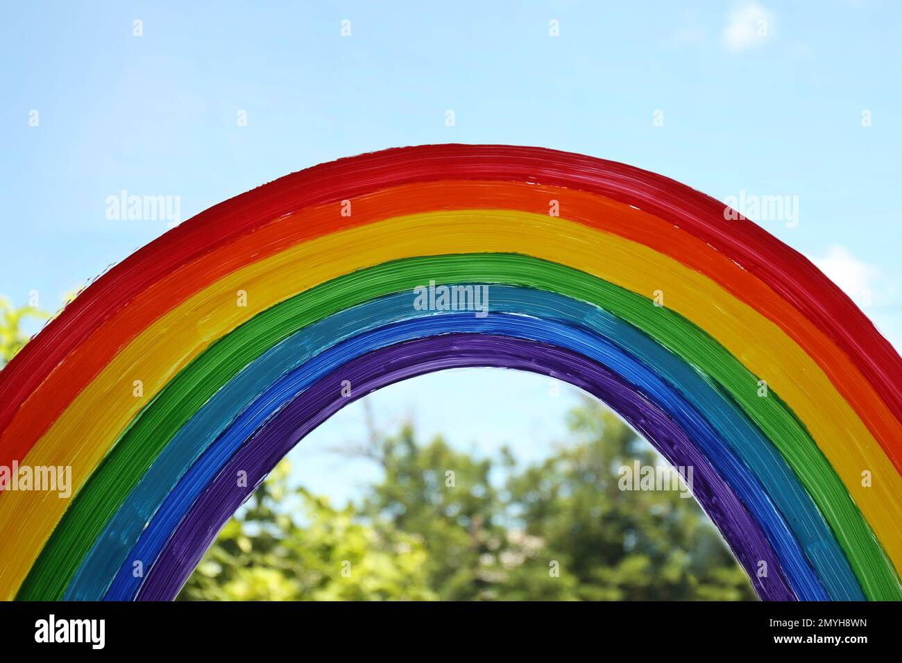 Painting of rainbow on window, closeup. Stay at home concept Stock ...