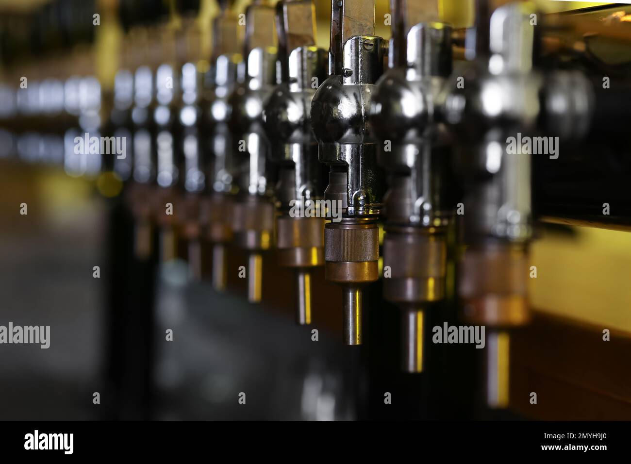 New modern beer taps in pub, closeup. Professional bar equipment Stock ...