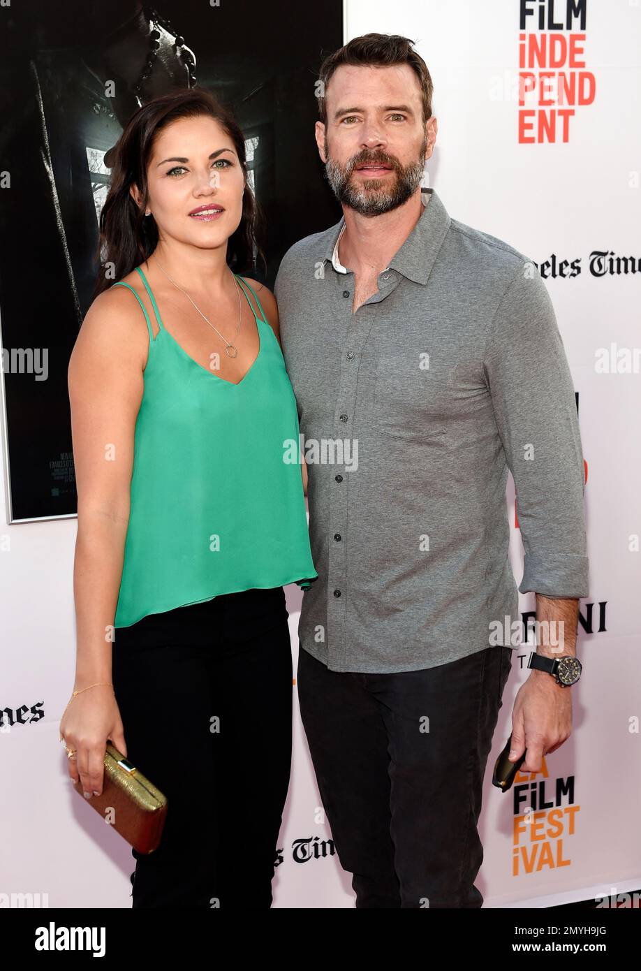 Actor Scott Foley and his wife Marika Dominczyk pose together at the ...