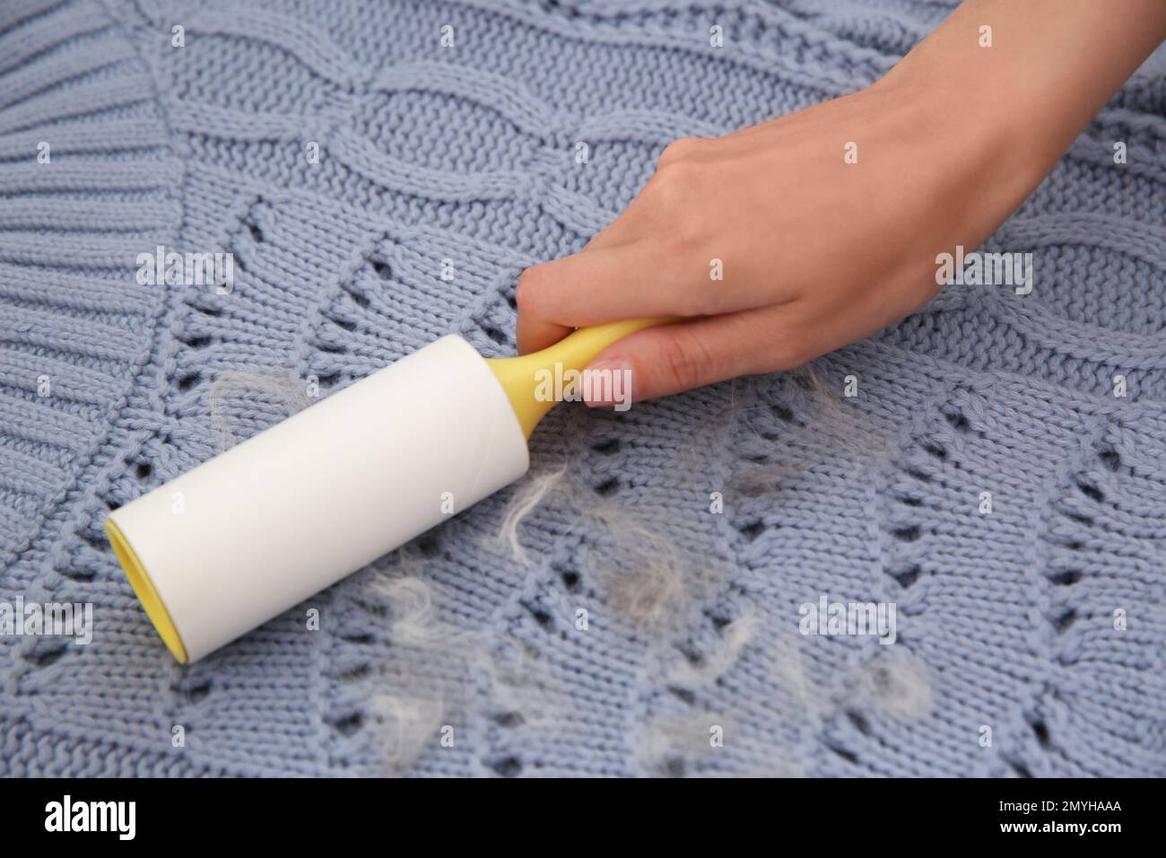Woman removing her sweater hi-res stock photography and images - Alamy