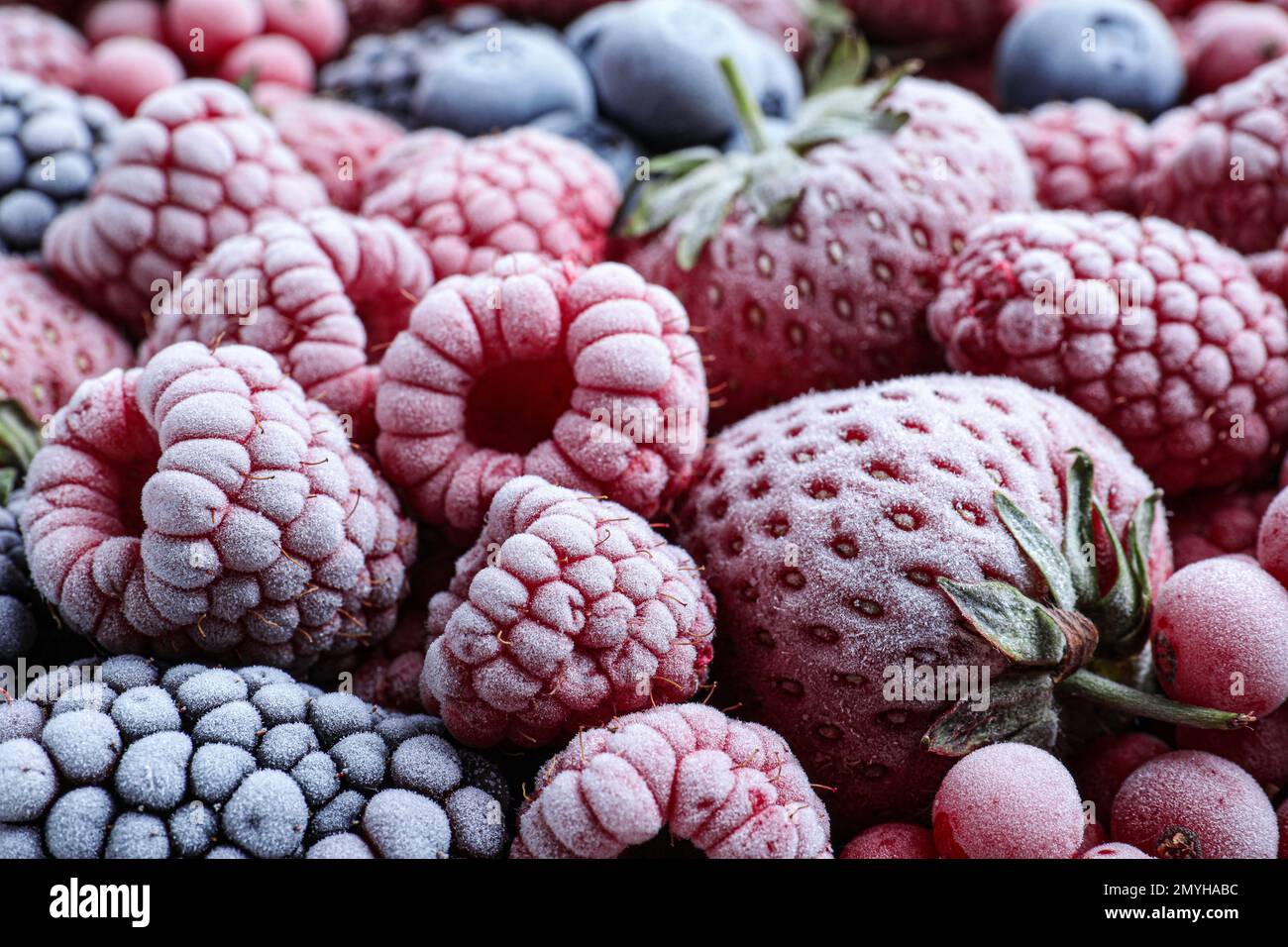 Mix of different frozen tasty berries as background, closeup Stock ...