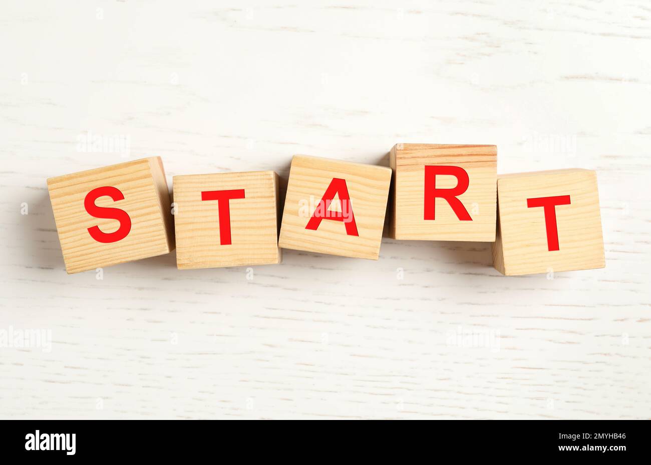 Word START made with wooden cubes on white background, flat lay Stock ...