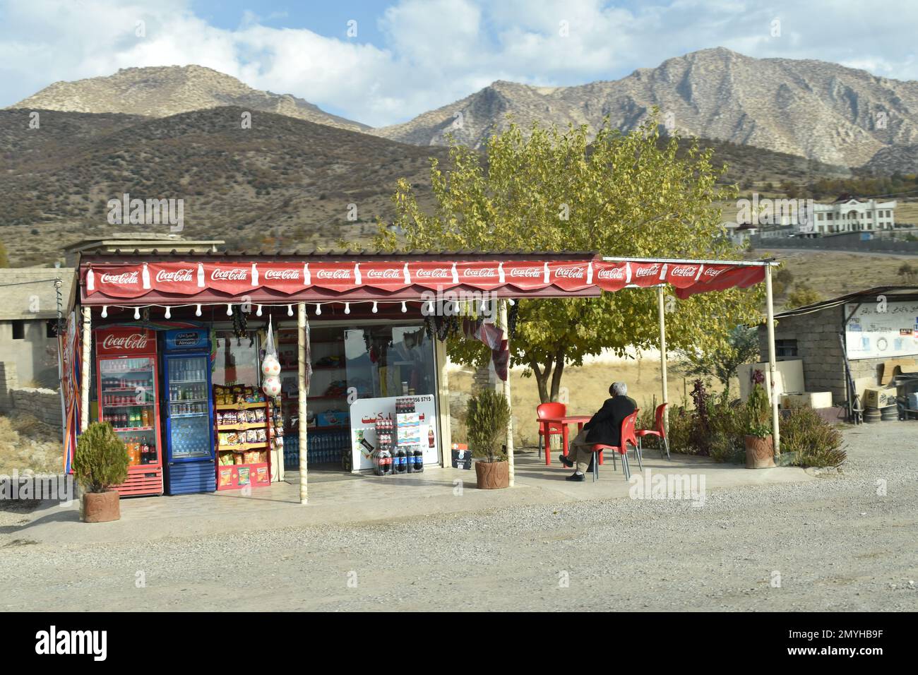 A person sitting alone at a roadside convenience store in Northern Iraq ...
