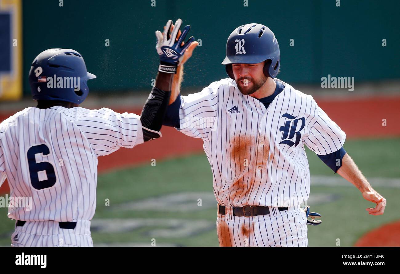 Rice's Grayson Lewis is greeted by Ryan Chandler (6) after scoring on ...