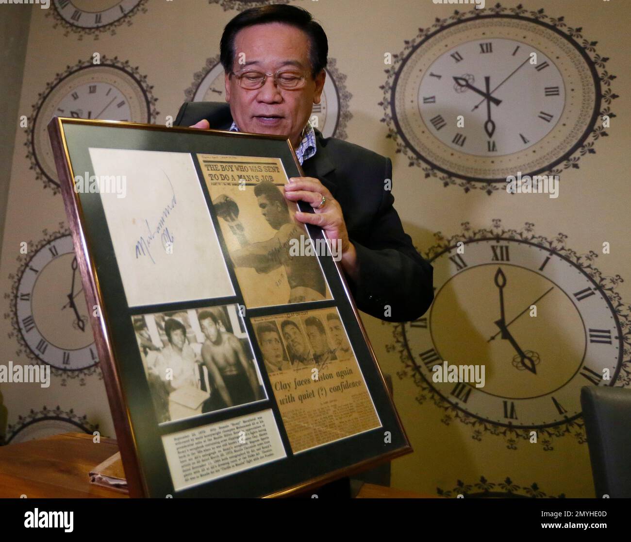 Filipino lawyer Romulo "Romy" Macalintal displays a framed autographed ...