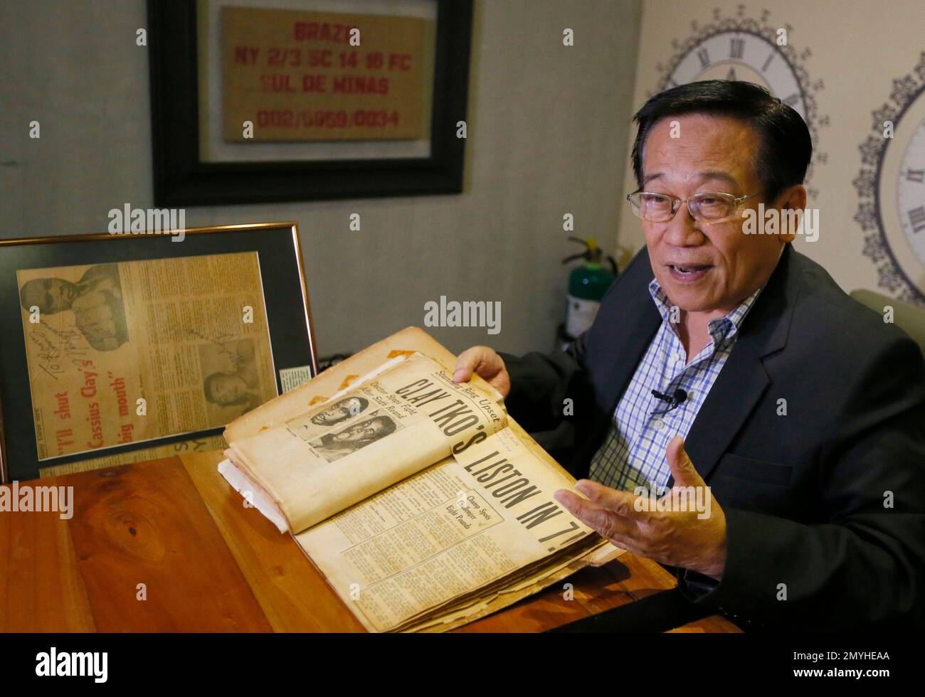 Filipino lawyer Romulo "Romy" Macalintal scans pages of his scrapbook ...