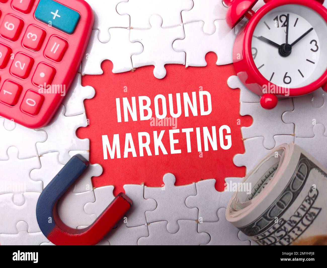 Alarm clock,magnet and banknotes with the word INBOUND MARKETING Stock ...