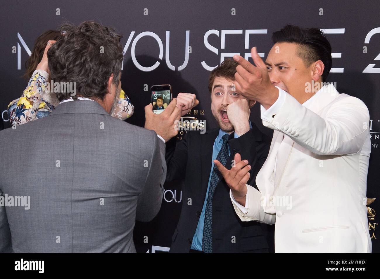 Mark Ruffalo, left, Daniel Radcliffe and Jon Chu attend the world ...