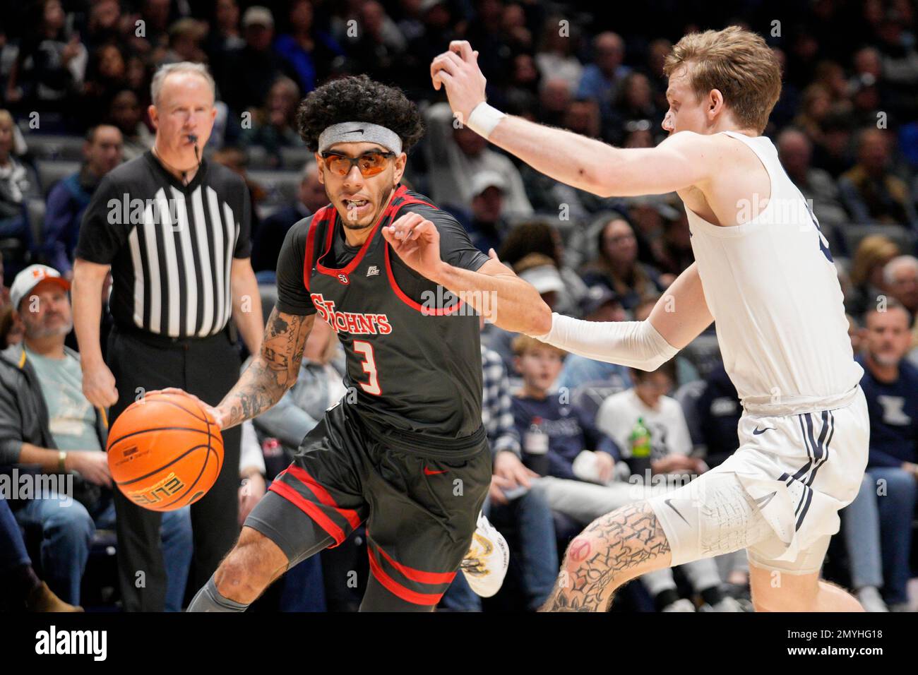 St. John's guard Andre Curbelo (3) drives against Xavier's Adam Kunkel ...