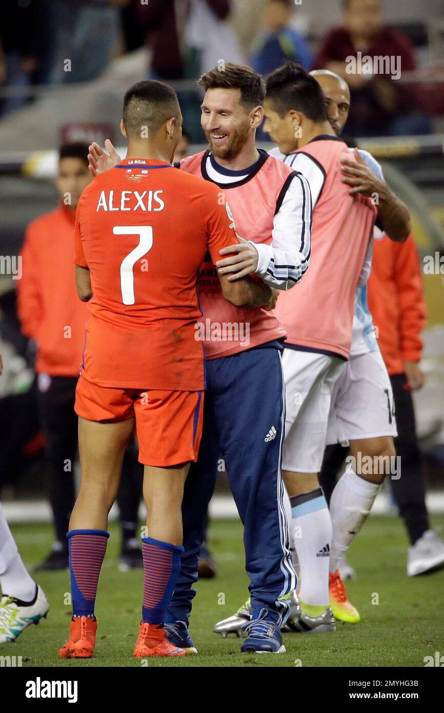 Argentina’s Lionel Messi, right, hugs Chile’s Alexis Sanchez at the end ...