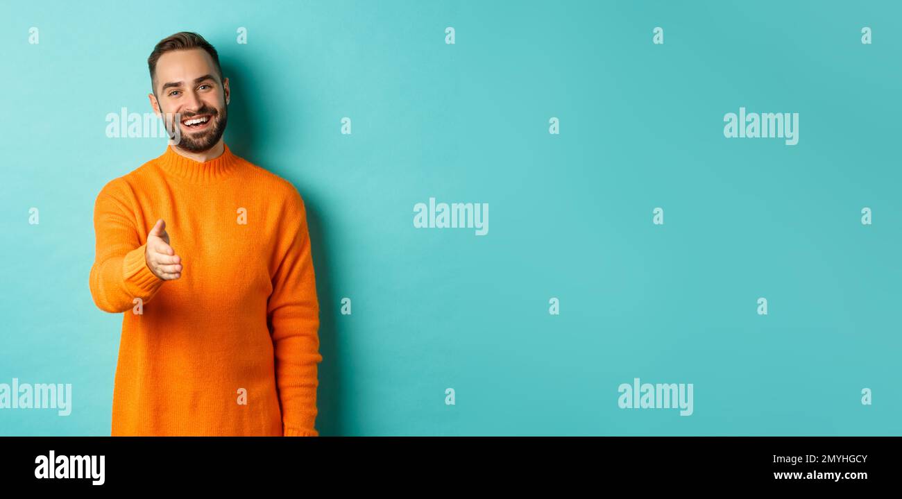 Friendly nice guy extend hand for handshake, greeting you and smiling ...