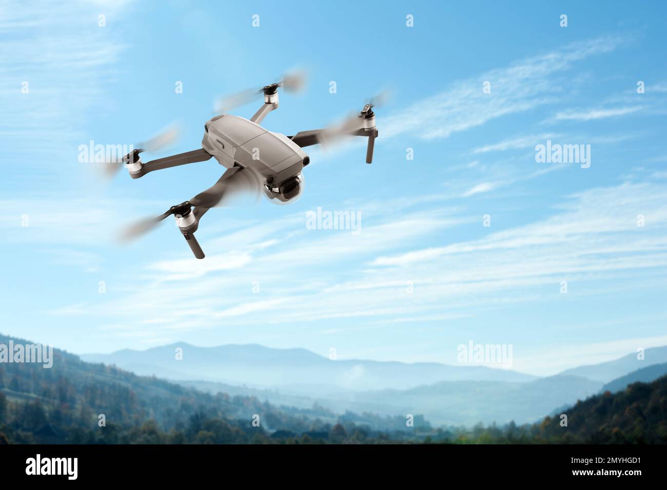 Modern drone flying over picturesque mountains. Aerial survey Stock ...