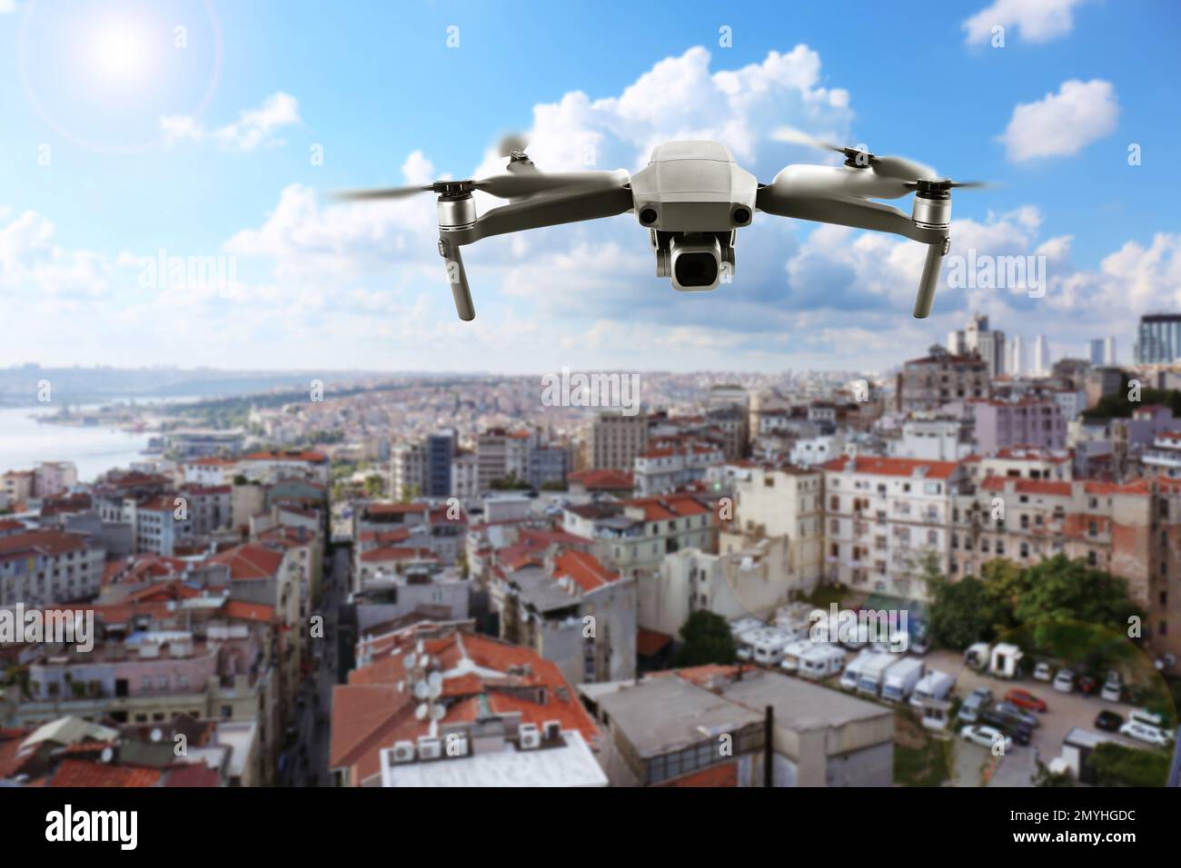 Modern drone flying over city. Aerial survey Stock Photo - Alamy