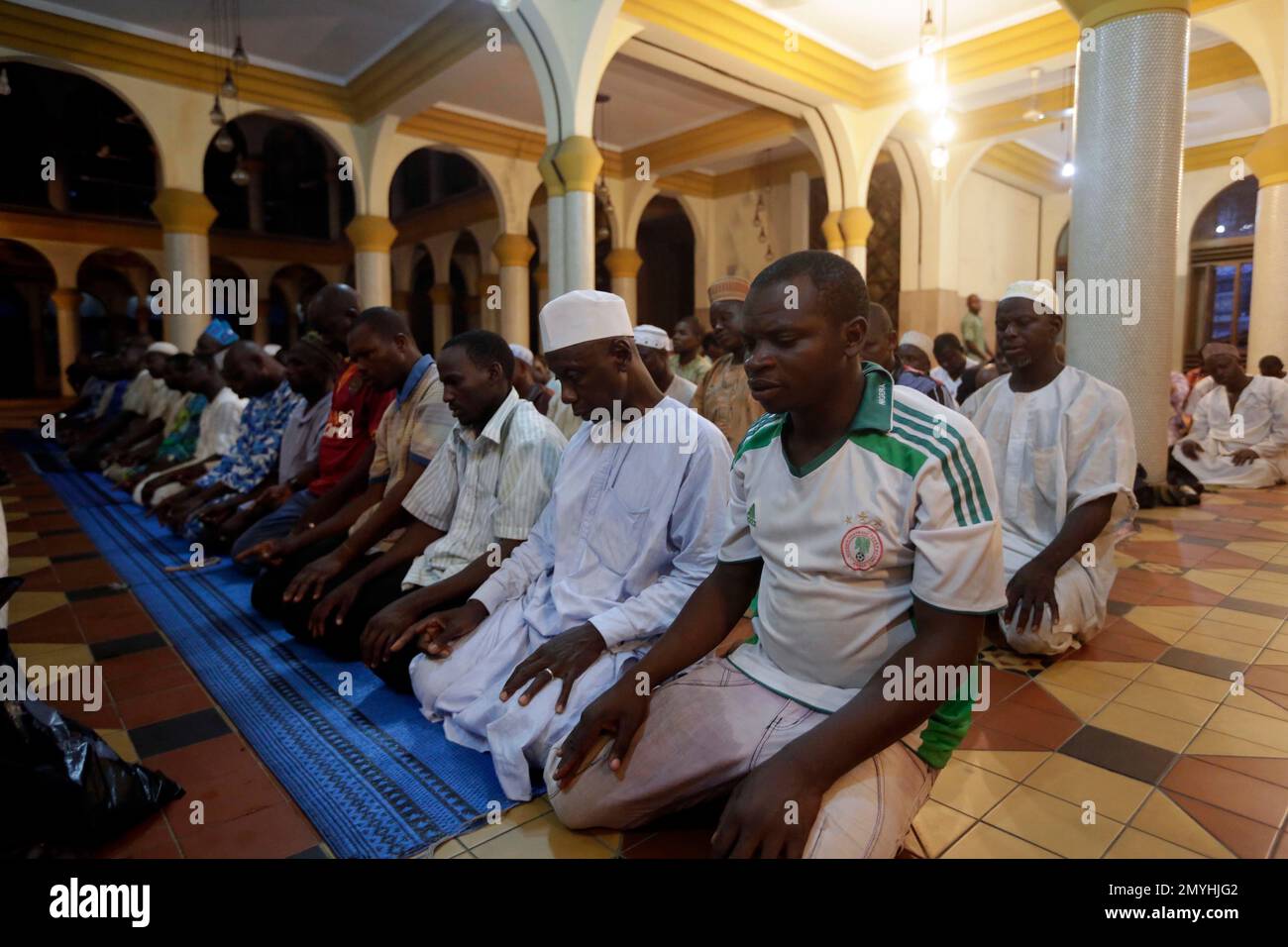 Nigerian Muslims offer prayers on the first day of Ramadan, at the ...