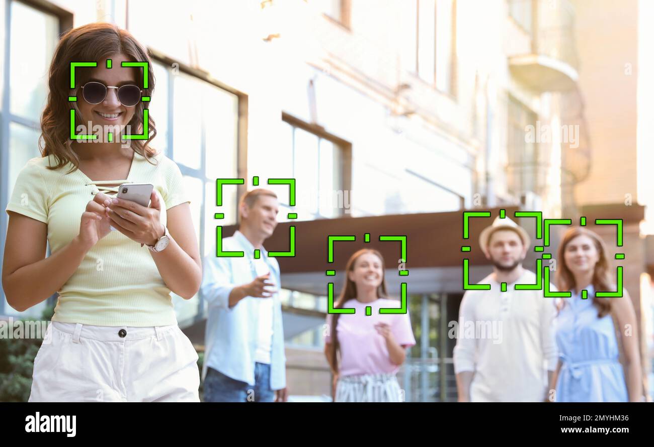 Facial recognition system identifying people on city street Stock Photo ...