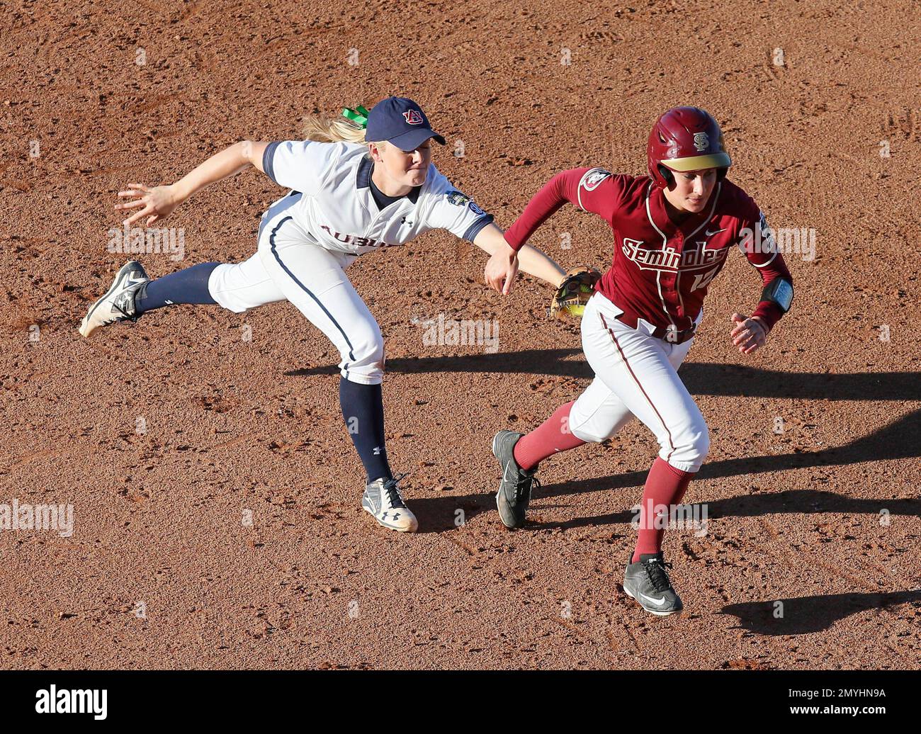 Auburn infielder Whitney Jordan, left, reaches to tag out Florida State ...