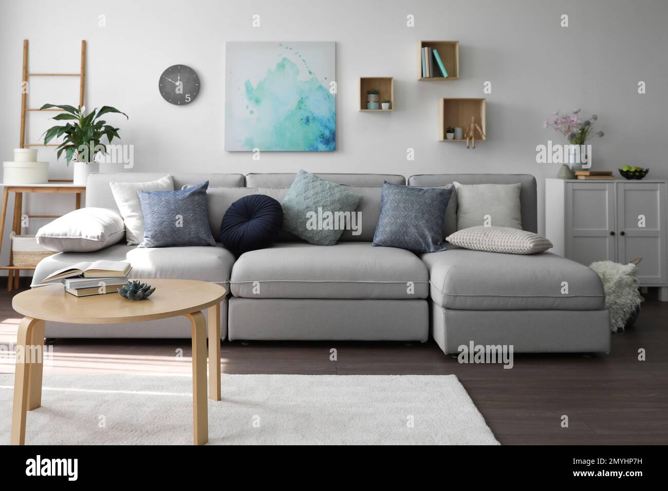 Elegant living room with comfortable sofa and wooden table. Interior ...