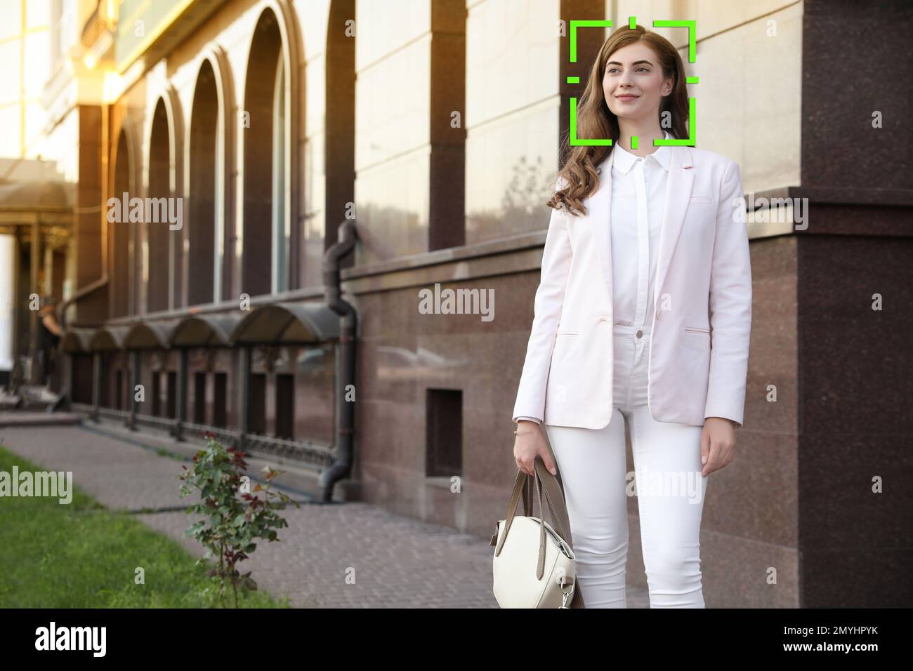 Facial recognition system identifying woman on city street Stock Photo ...