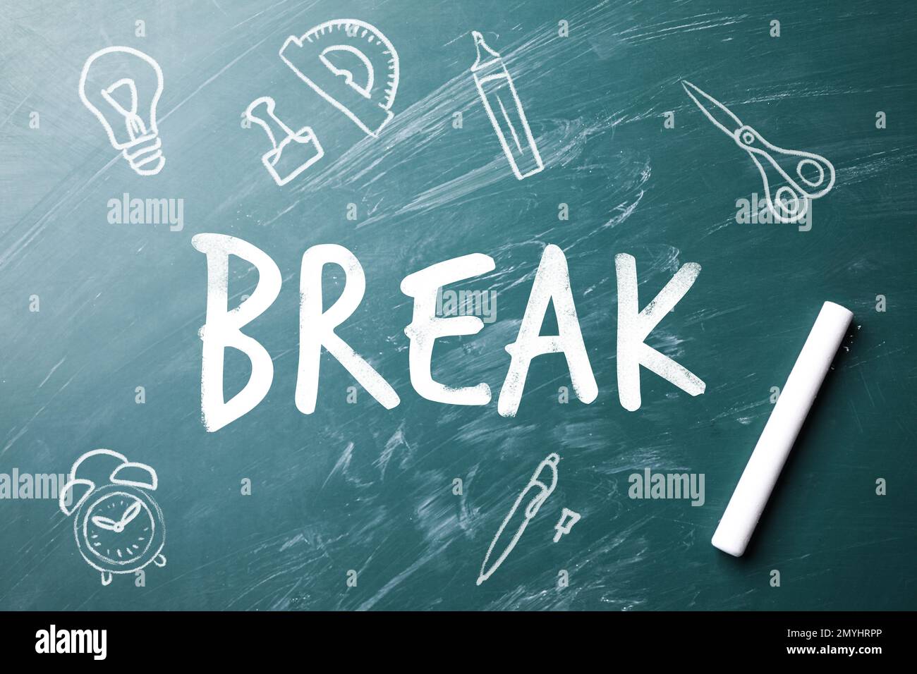 Word Break with drawings and chalk on greenboard, top view. School ...
