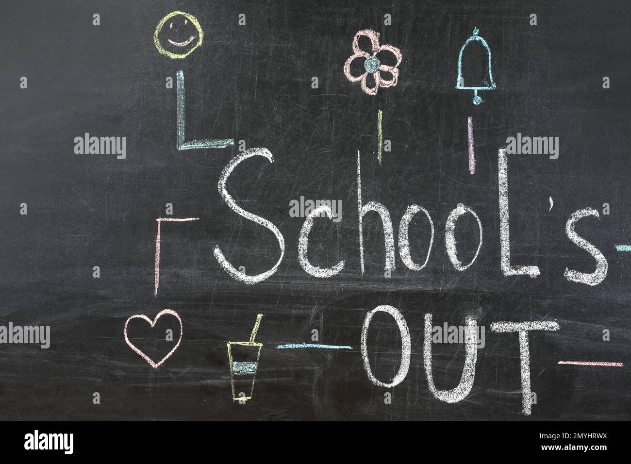 Text School's Out and drawings on black chalkboard. Summer holidays ...